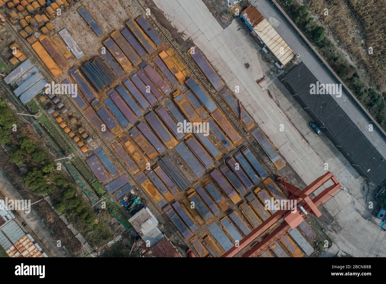 aerial view of steel plates and metal profiles stocked in a factory ...