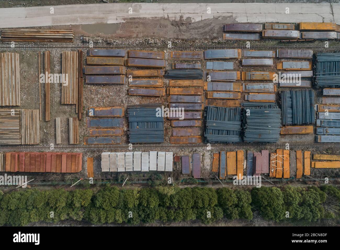 aerial view of steel plates and metal profiles stocked in a factory ...