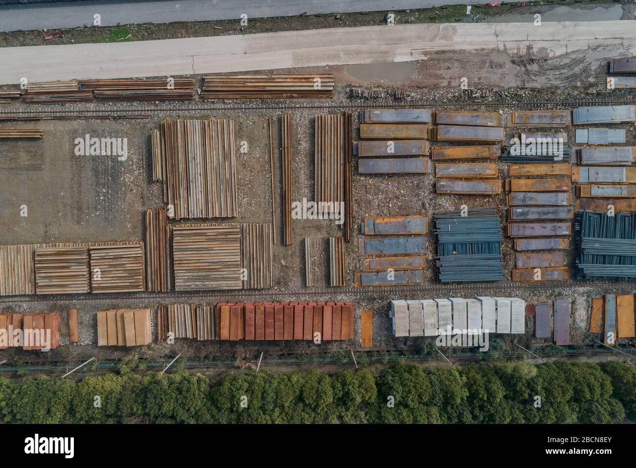 aerial view of steel plates and metal profiles stocked in a factory ...