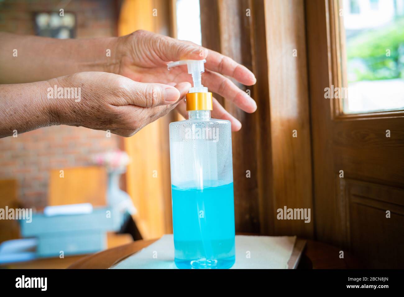 Women hand washing with ethyl alcohol gel or antibacterial soap ...