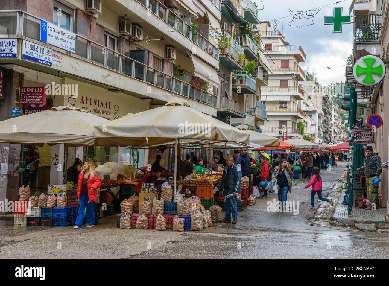 People shopping at the weekly public market of agricultural products in ...
