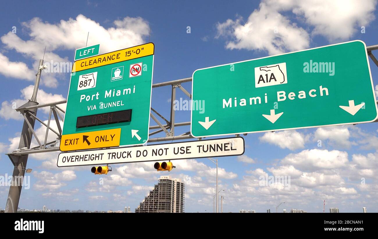 Street sign Port of Miami and Miami Beach - MIAMI, USA APRIL 10, 2016 ...