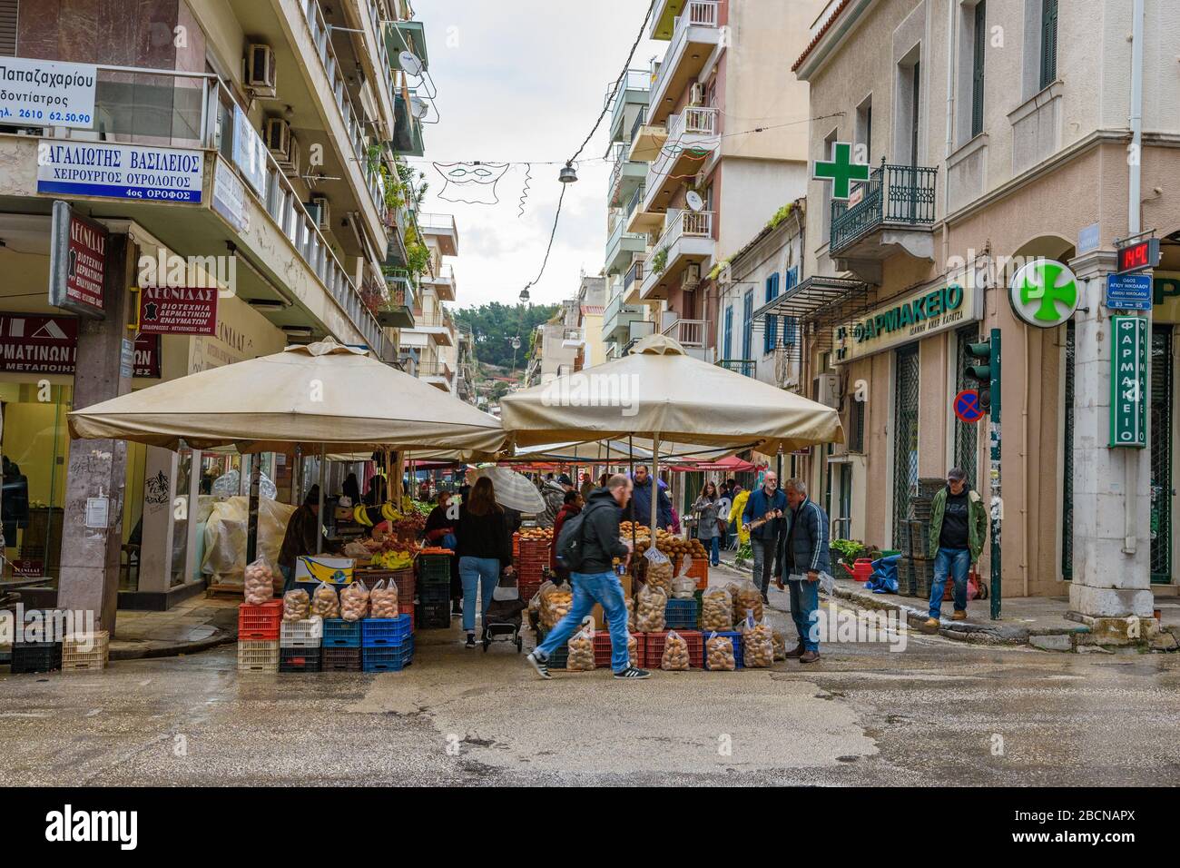 People shopping at the weekly public market of agricultural products in ...