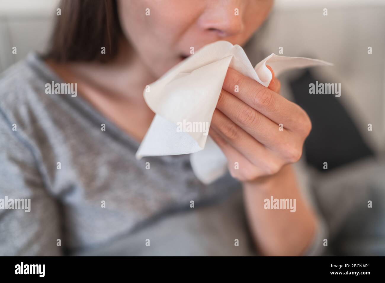 Cough in tissue covering nose and mouth when coughing as COVID-19 ...