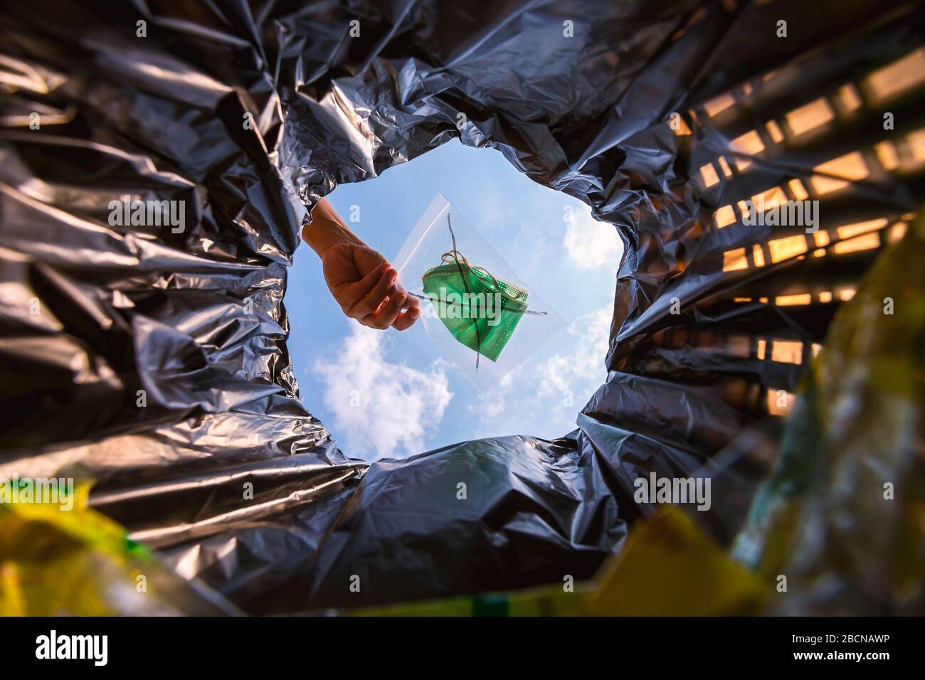Face mask pack in zip lock before throw into the trash. With a worm ...