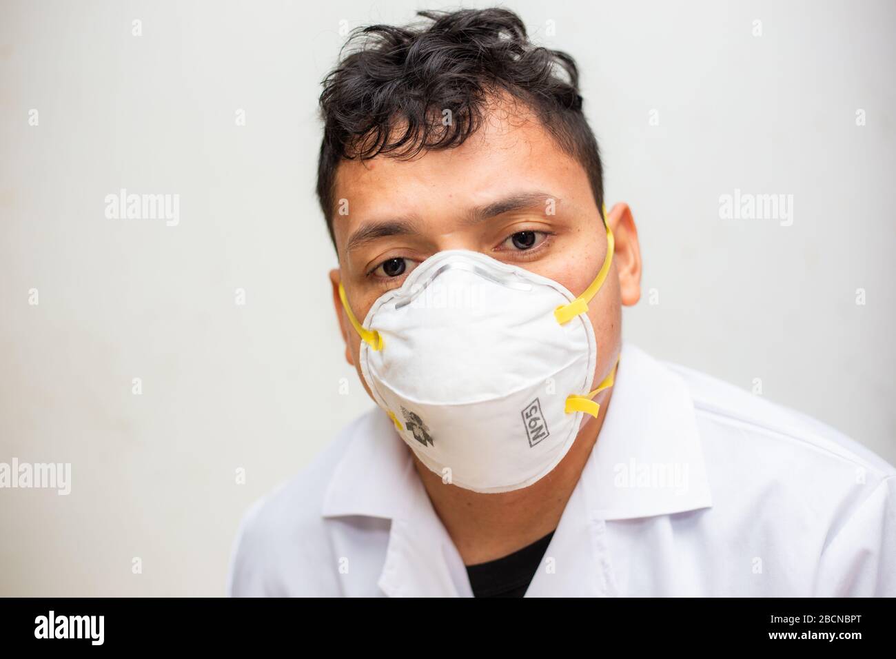 Young asian man wear N95 mask protect dusk and COVID 19 on white ...