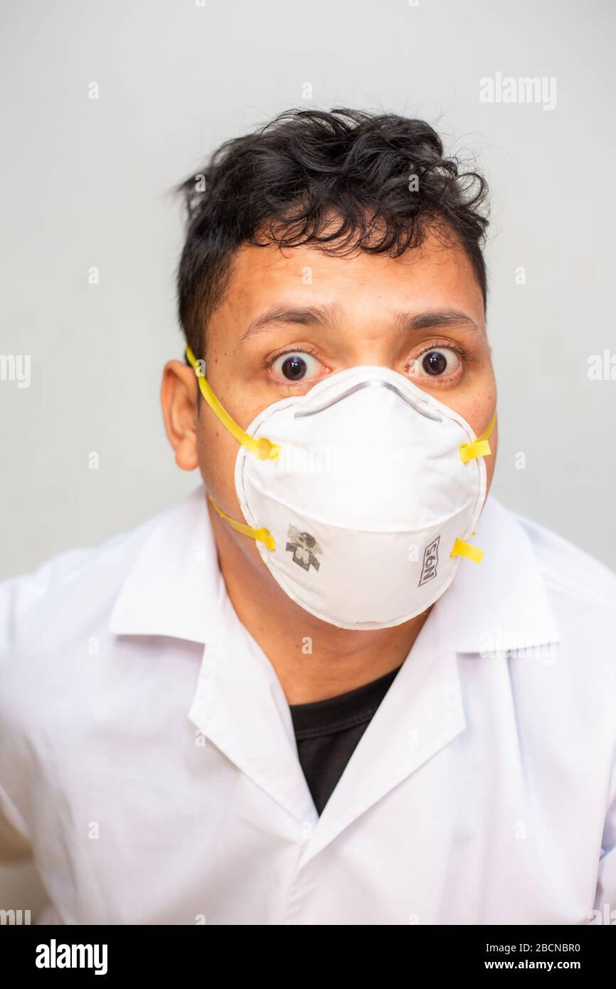 Young asian man wear N95 mask protect dusk and COVID 19 on white ...