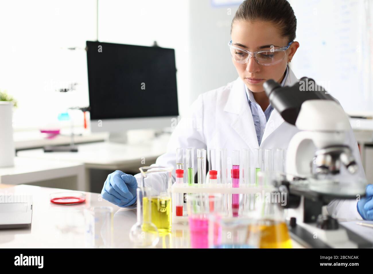 Lab assistant making chemical analysis Stock Photo - Alamy