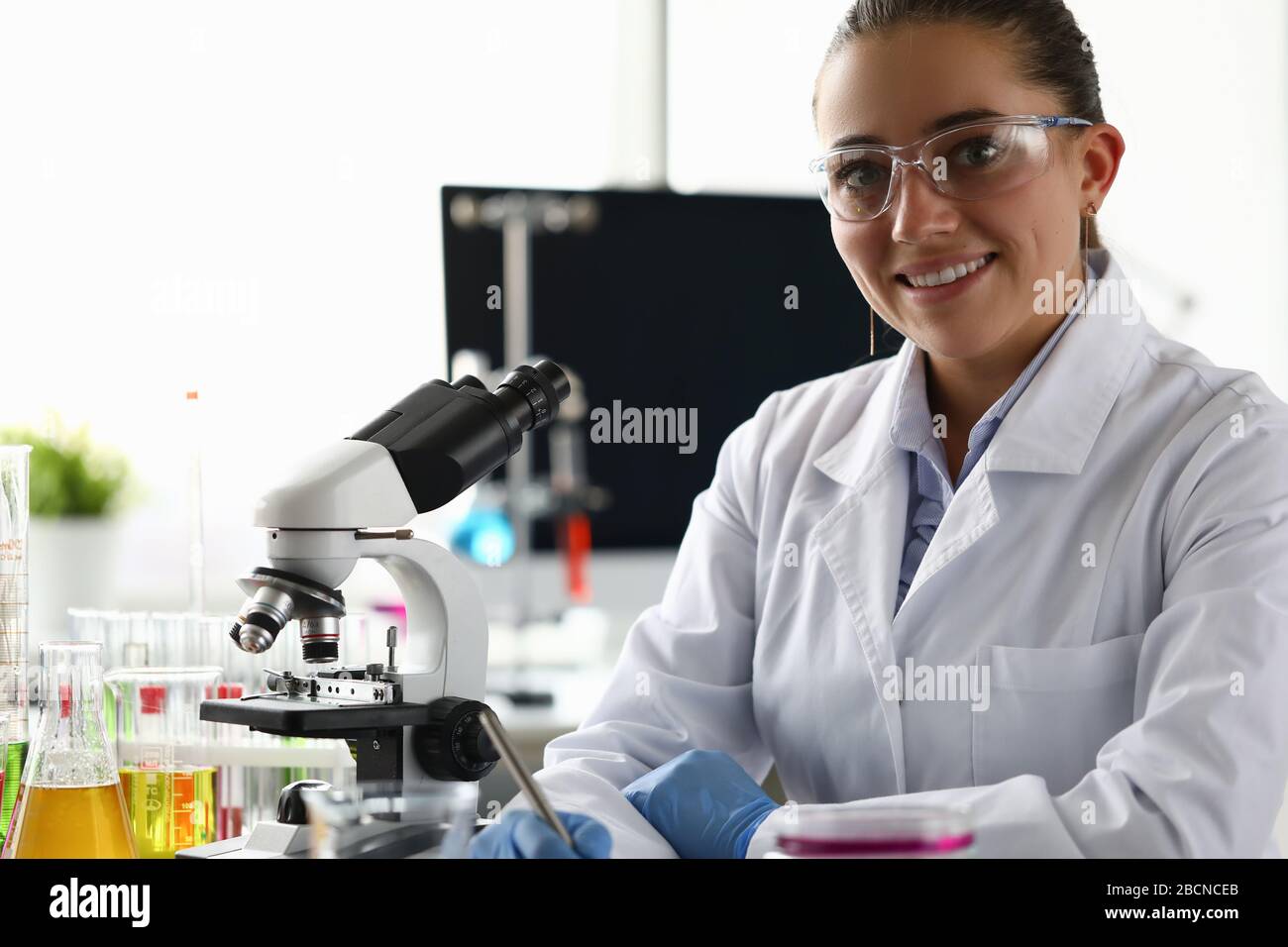 Cheerful chemist in uniform Stock Photo - Alamy