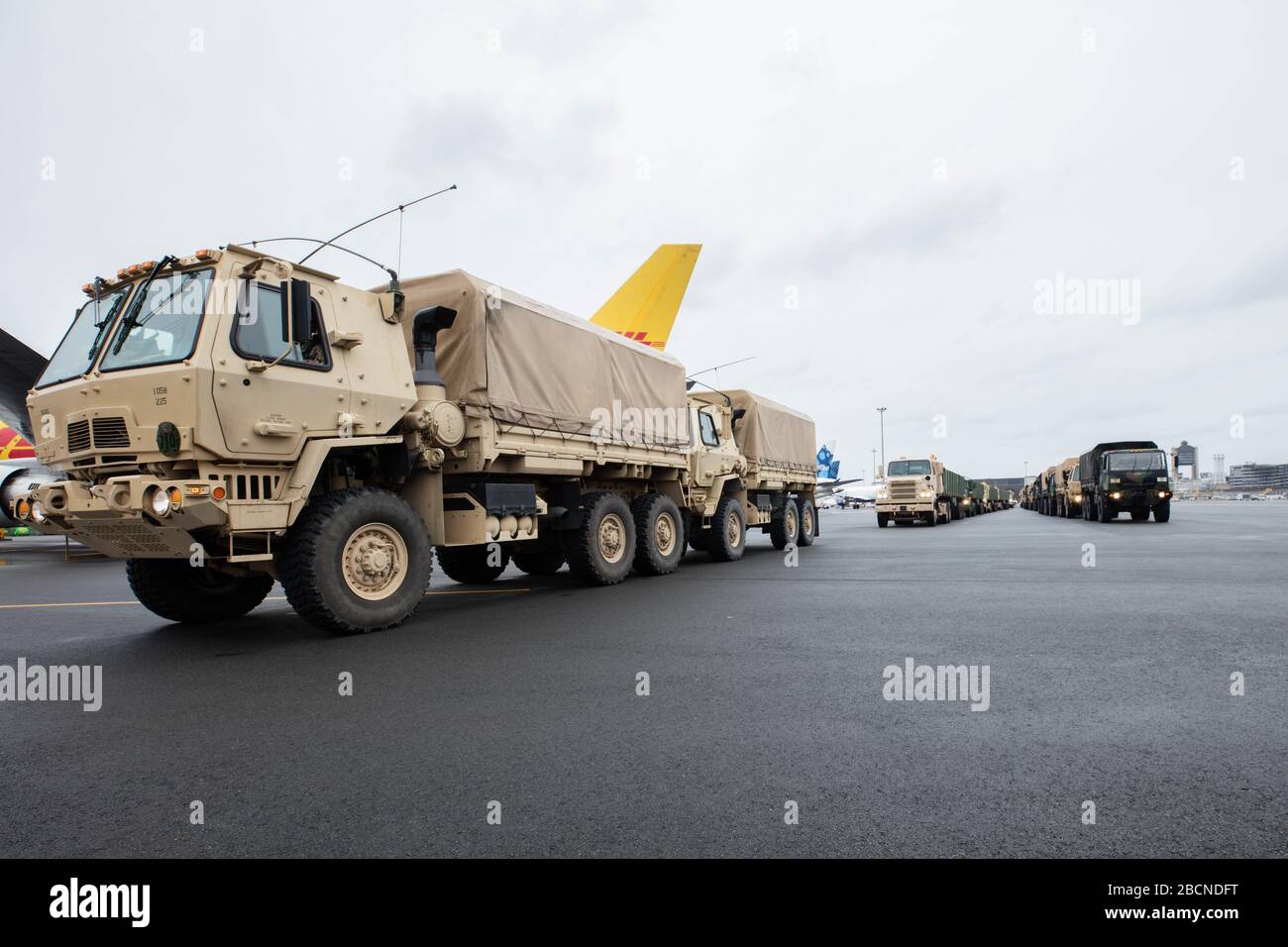BOSTON--Massachusetts National Guard vehicles line up at Logan Airport ...