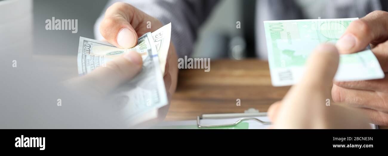 People exchanging money cash Stock Photo - Alamy