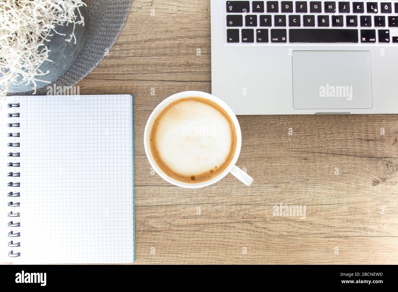 Coffee mug on a rustic table with laptop and notepad / Homeoffice ...