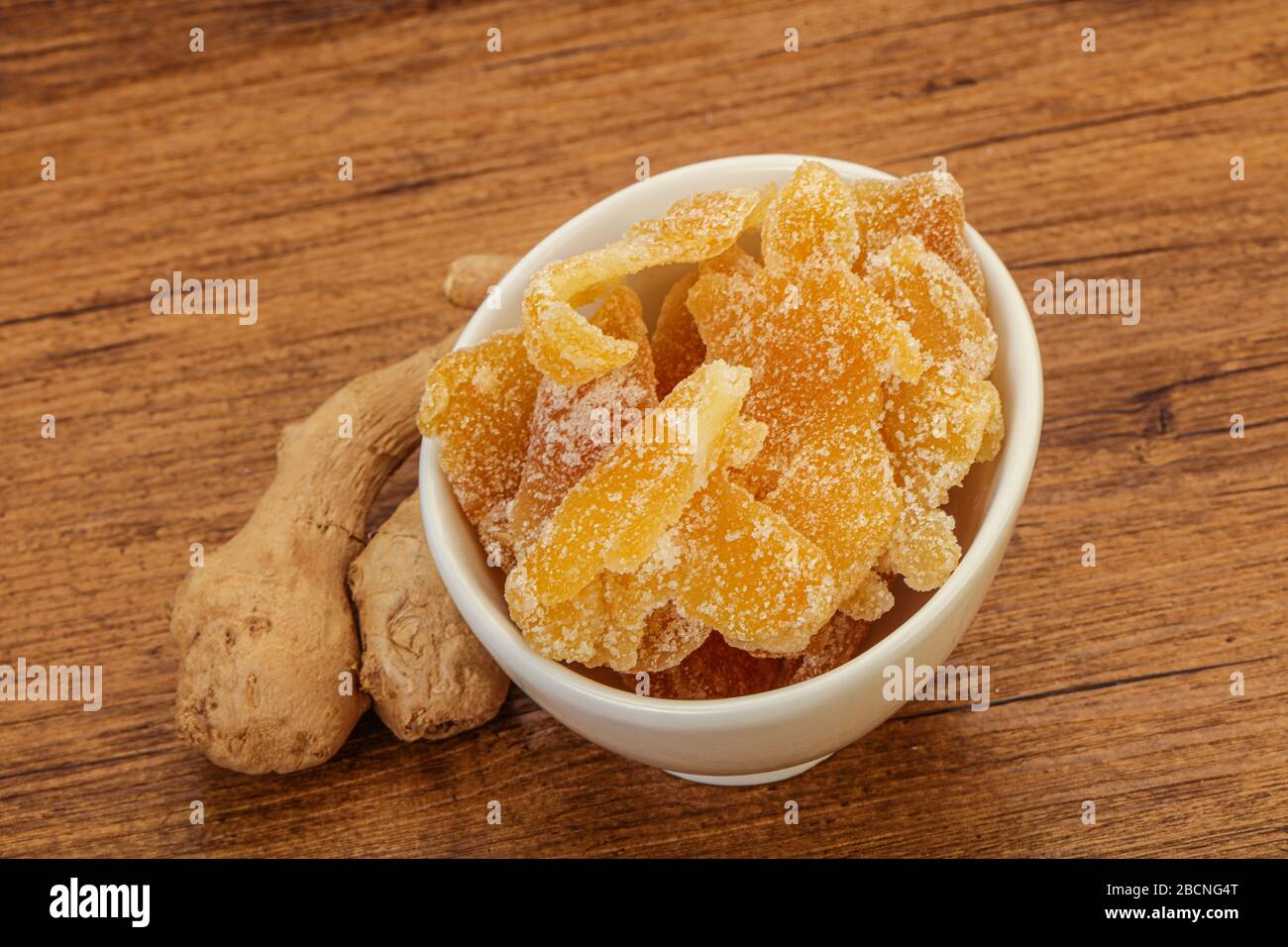 Dry sweet ginger snack in the bowl Stock Photo - Alamy