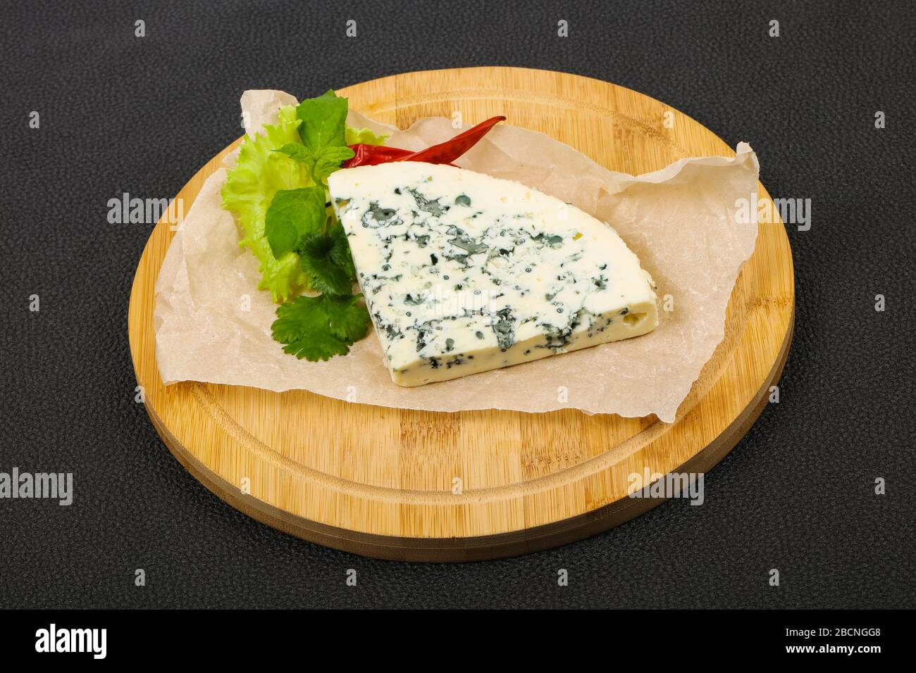 Blue cheese slice with salad leaves Stock Photo - Alamy