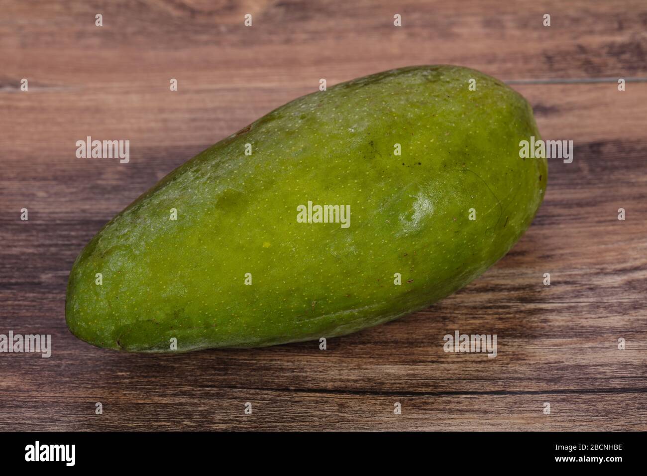 Green tasty mango over background Stock Photo - Alamy