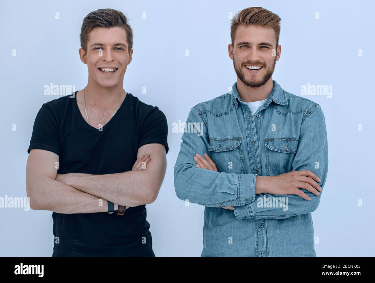 A full-length shot of two friends standing Stock Photo - Alamy
