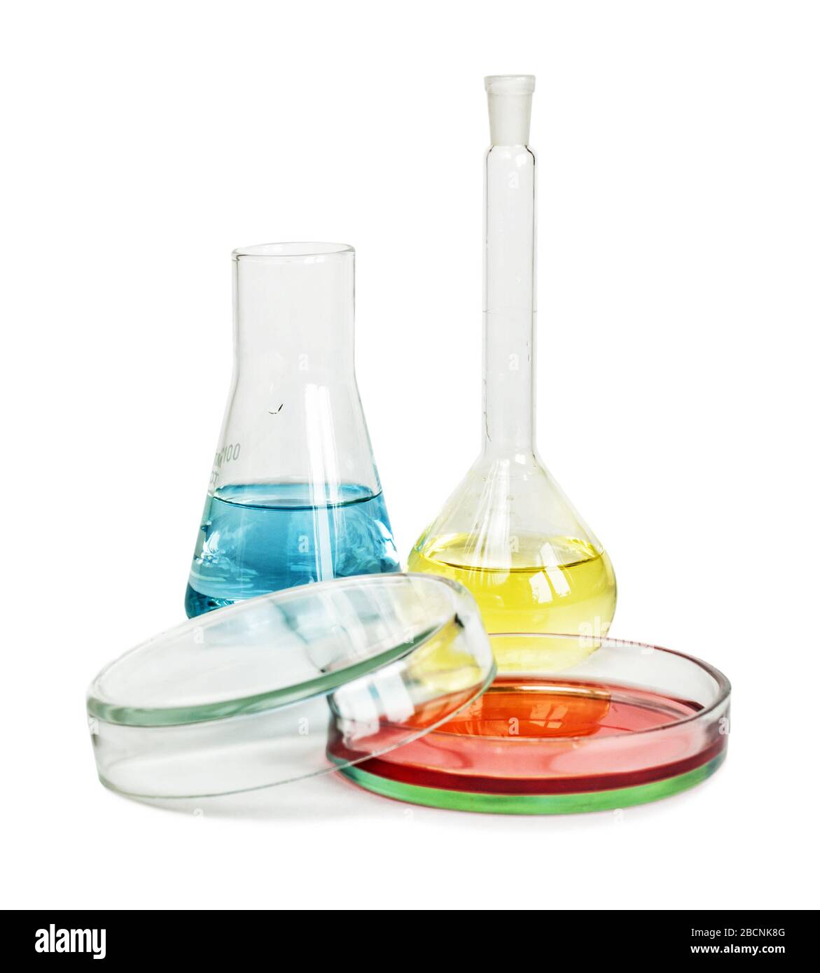 Miscellaneous laboratory glassware with colored solutions isolated on a ...