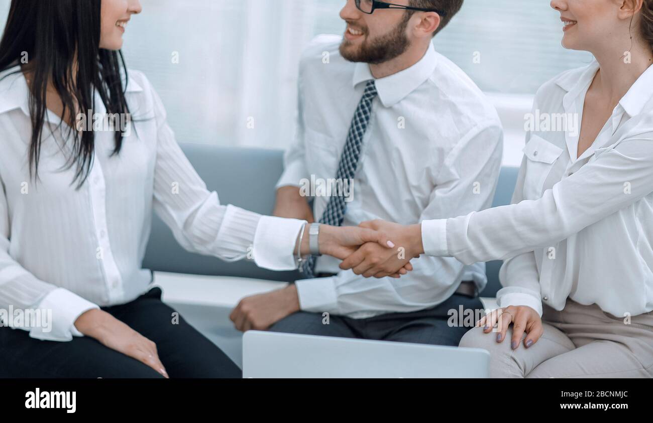 handshake of manager and client in the office lobby Stock Photo - Alamy