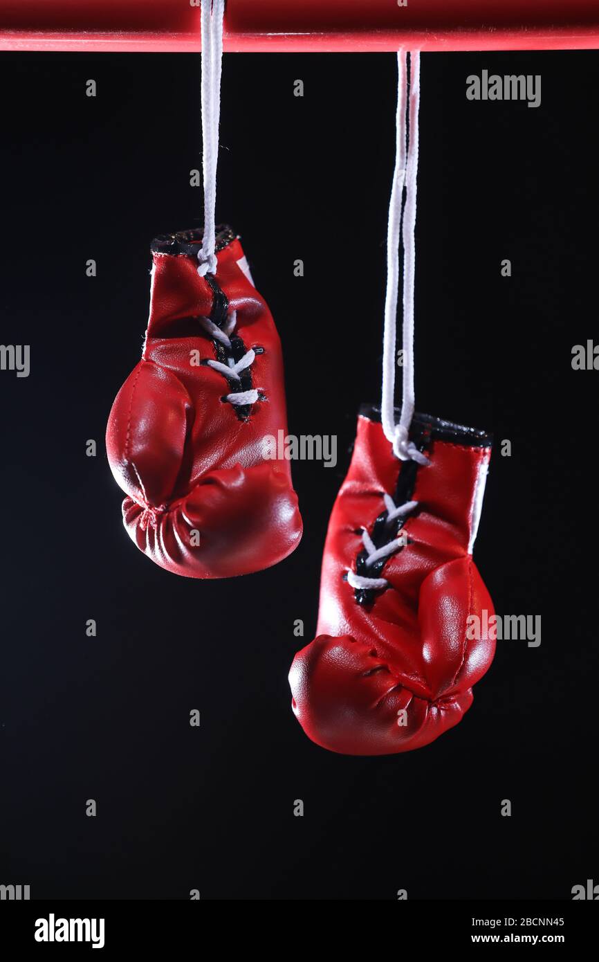 Red boxing gloves on a ring. Boxing and kickboxing competition Stock ...