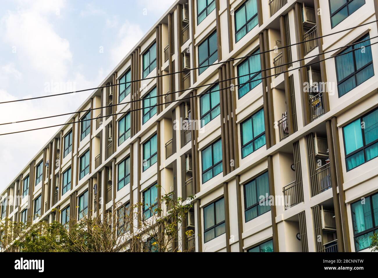 Modern condominium building in the city sky cloud background, Lowrise ...