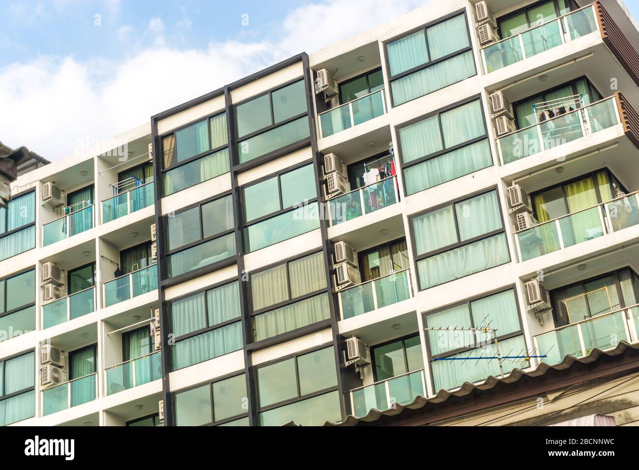 Modern condominium building in the city sky cloud background, Lowrise ...