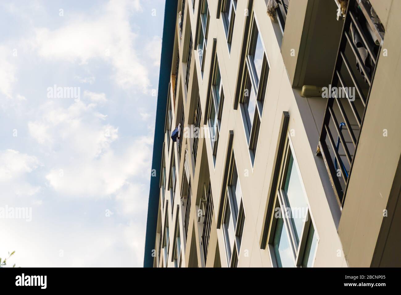 Modern condominium building in the city sky cloud background, Lowrise ...