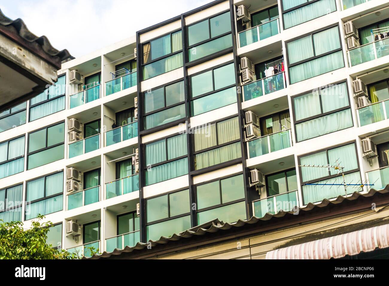 Modern condominium building in the city sky cloud background, Lowrise ...