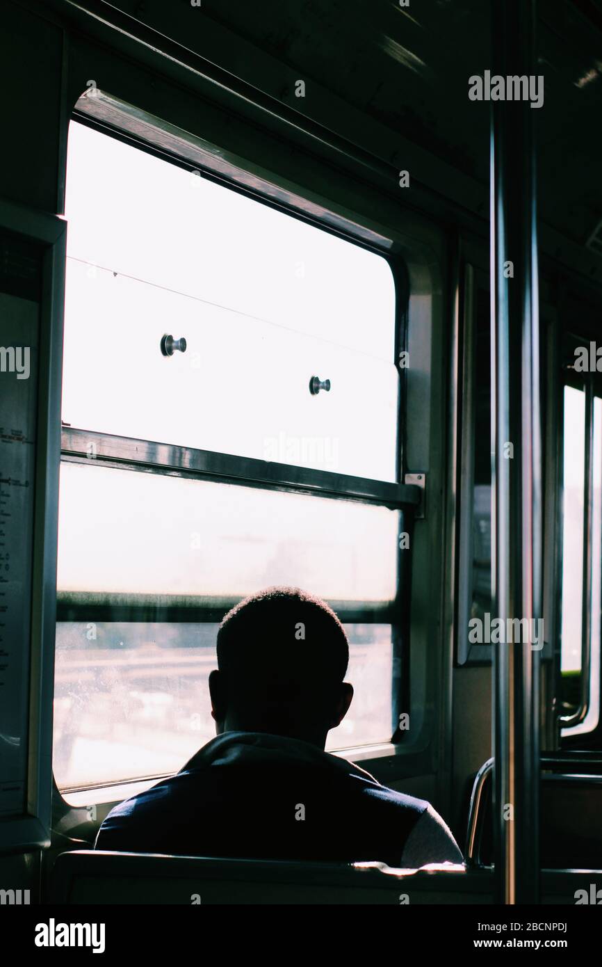 Person looking through the window Stock Photo - Alamy