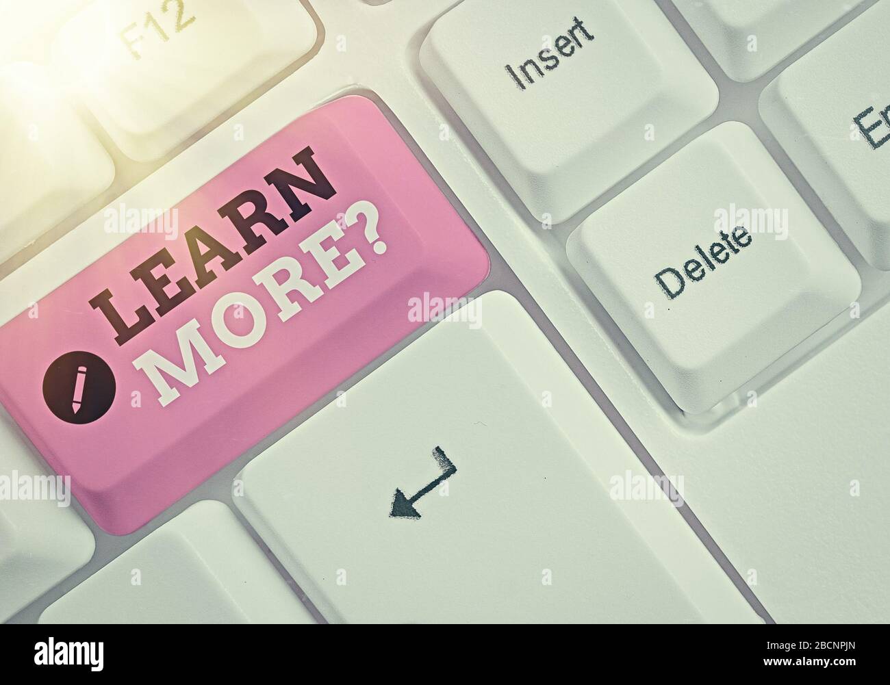 Writing note showing Learn More question. Business concept for gain ...