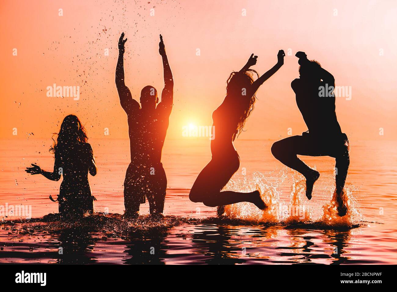 Happy Friends Sunset Jump Friendship High Resolution Stock Photography ...
