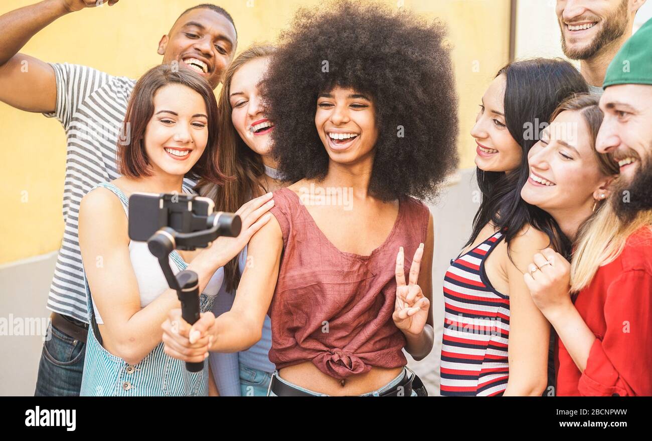 Happy millennials friends making video for social media with phone ...