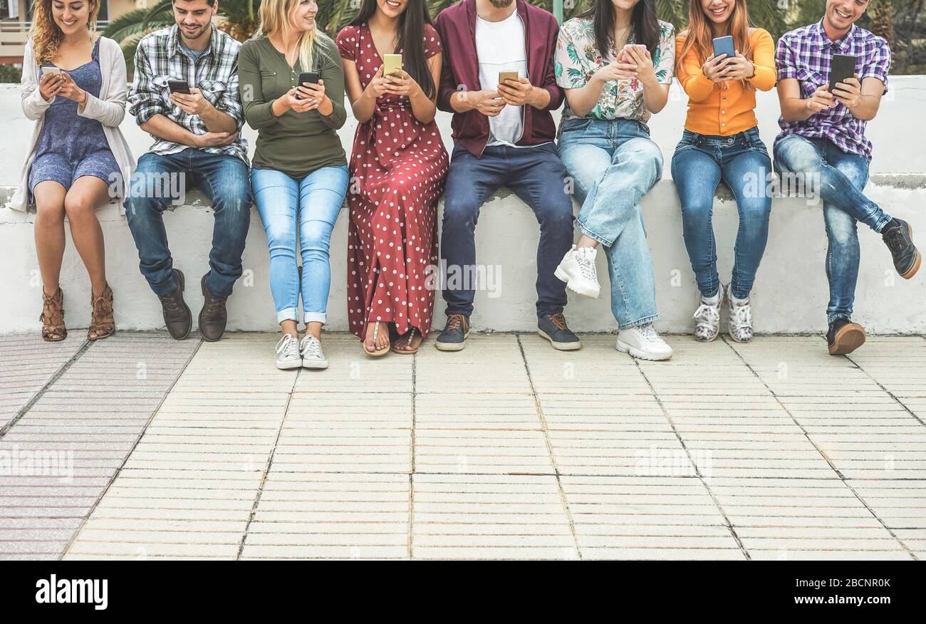 Group of friends using smart mobile phones app - Teenagers addiction to ...