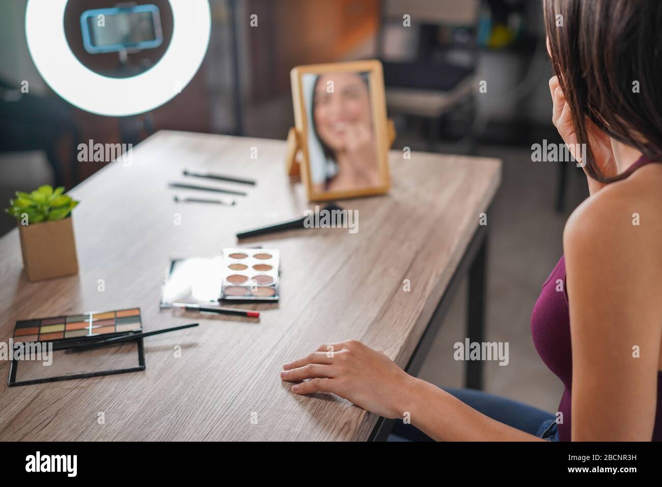 Young influencer woman creating social media videos with smartphone ...