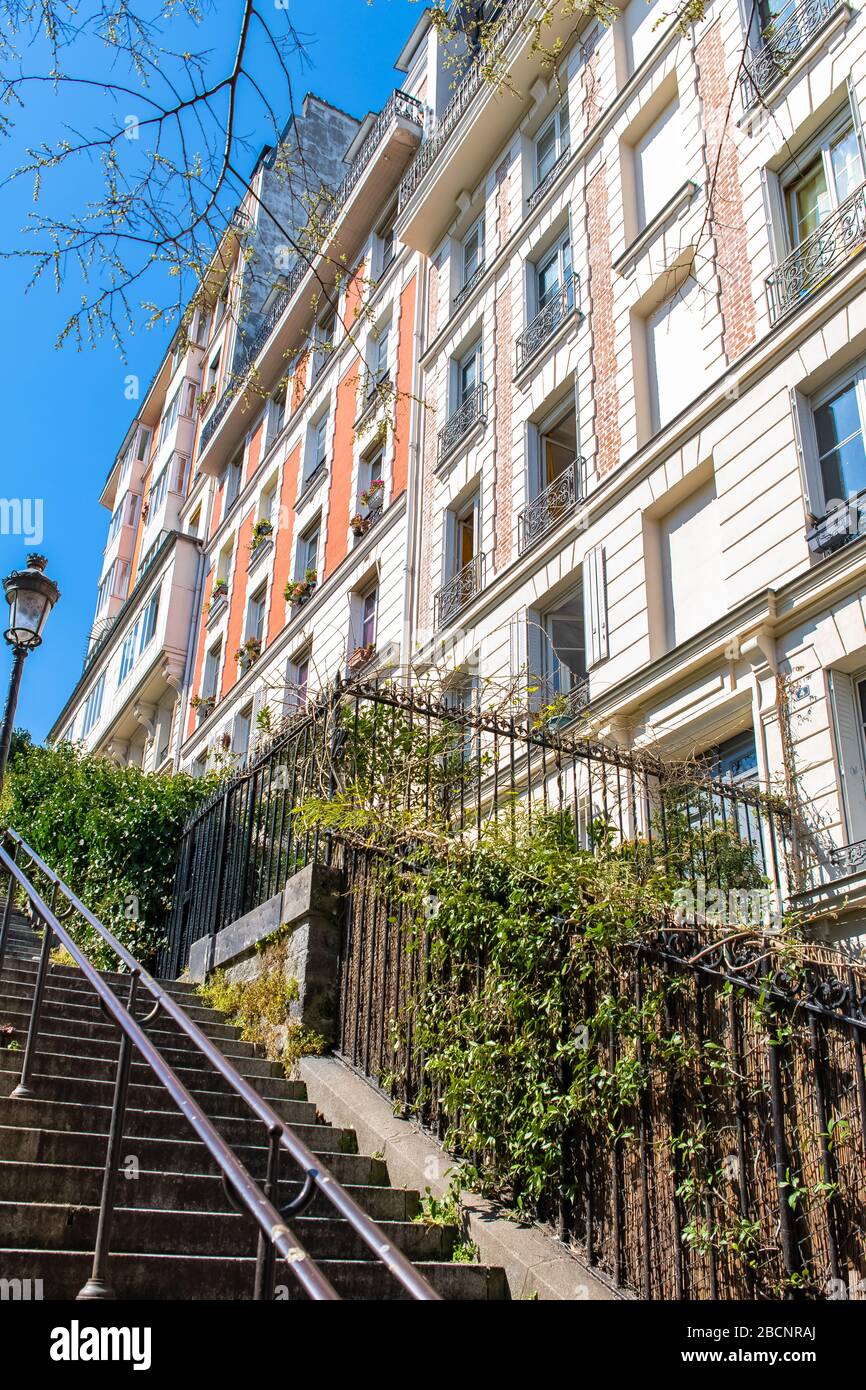 Paris, romantic staircase in Montmartre, typical buildings and floor ...