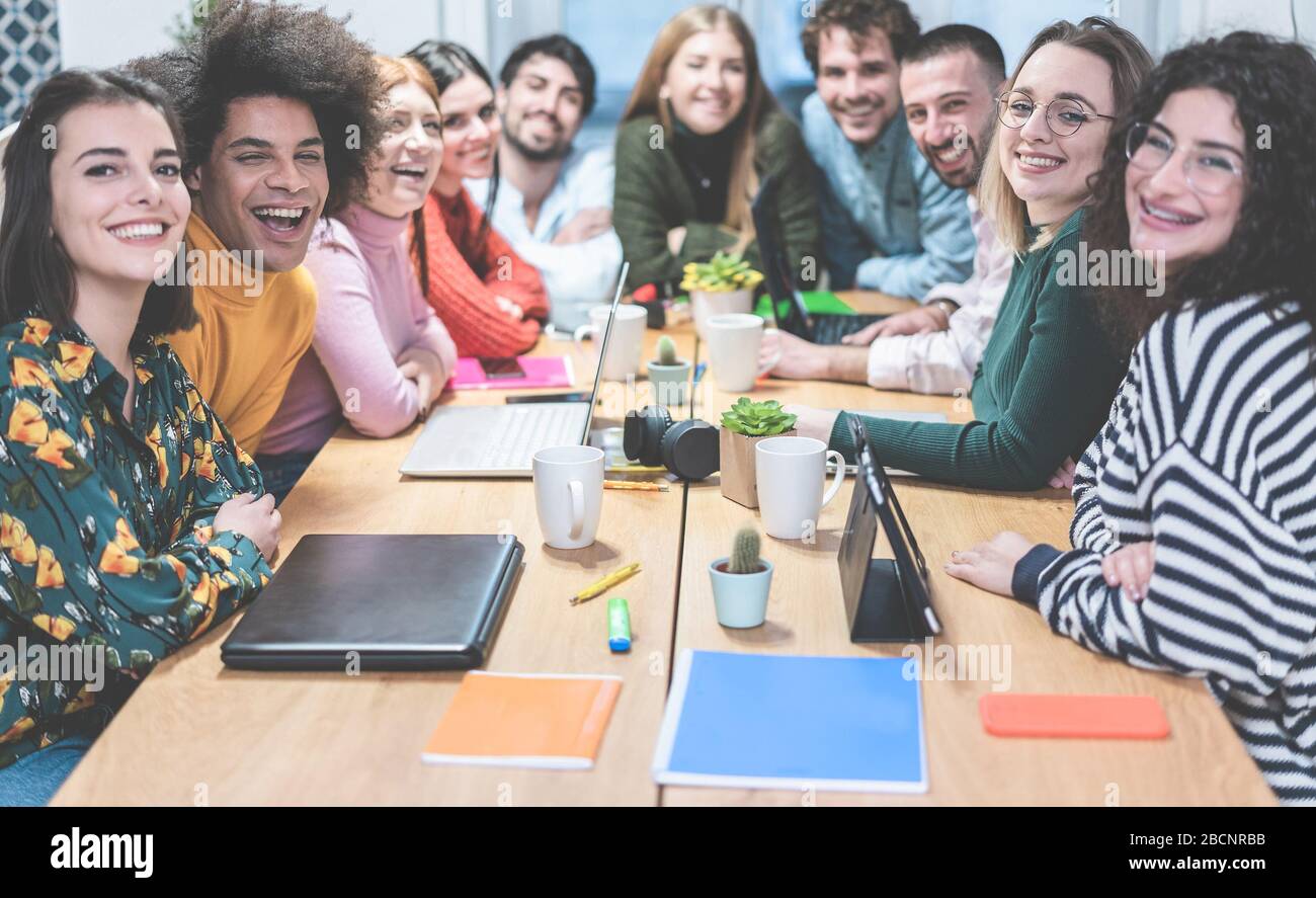 Young co-workers team talking during startup - Happy people planning a ...