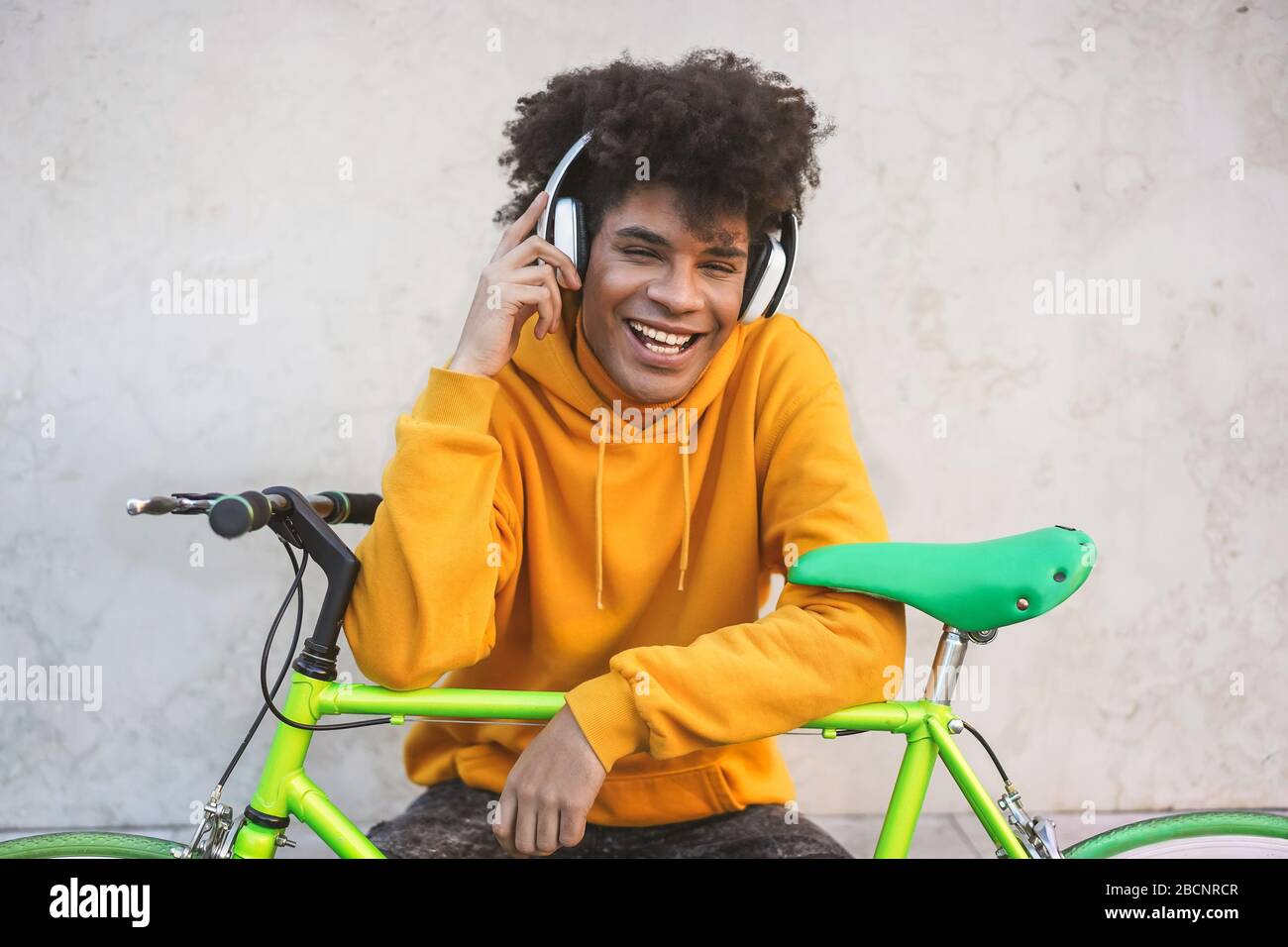 Happy african millennial guy listening music playlist outdoor - Young ...