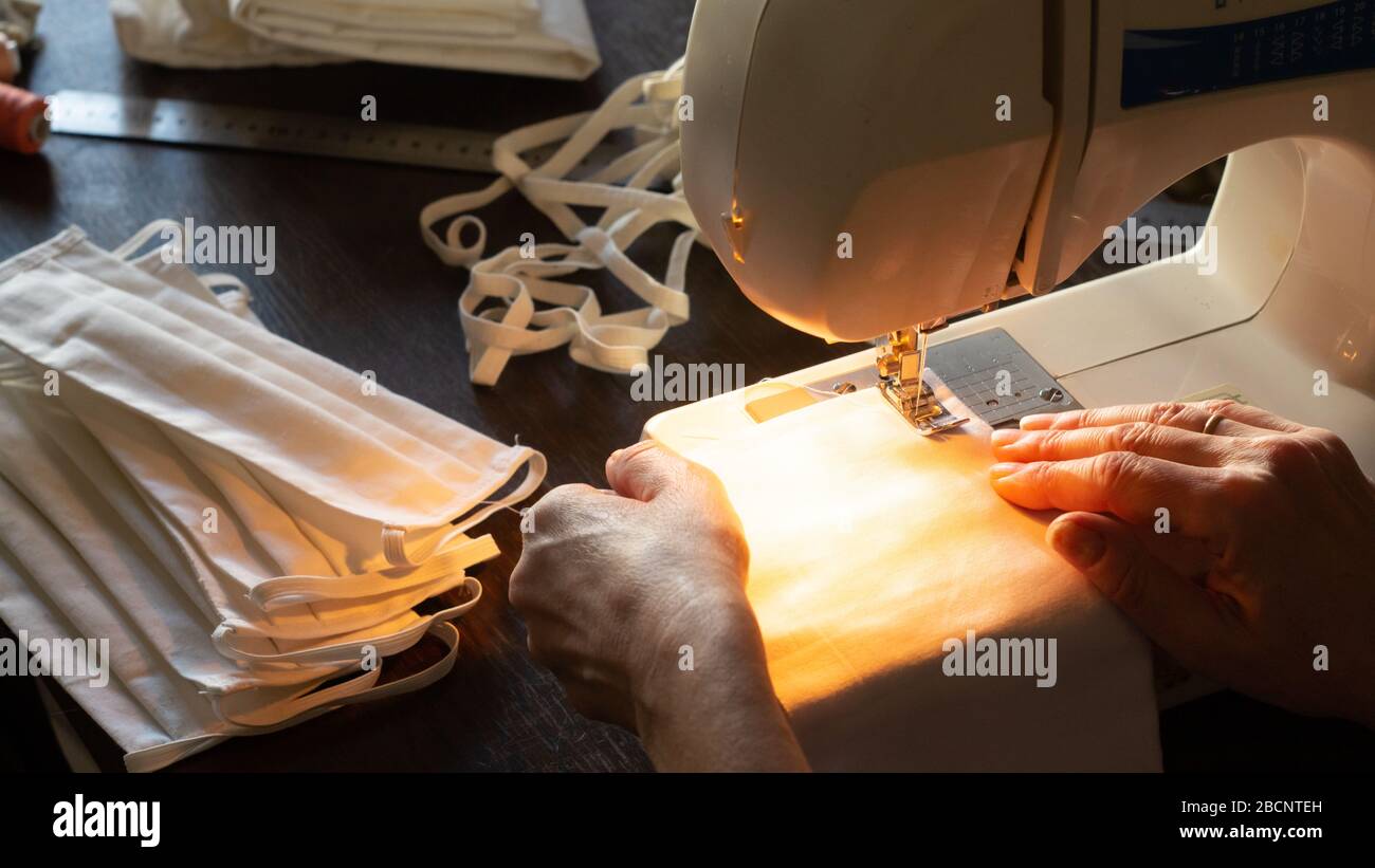 Woman sewing medical masks on hi-res stock photography and images - Alamy