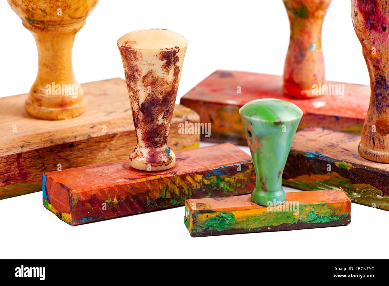 Few simple old artsy wooden hand stamps group, worn splashed, covered ...