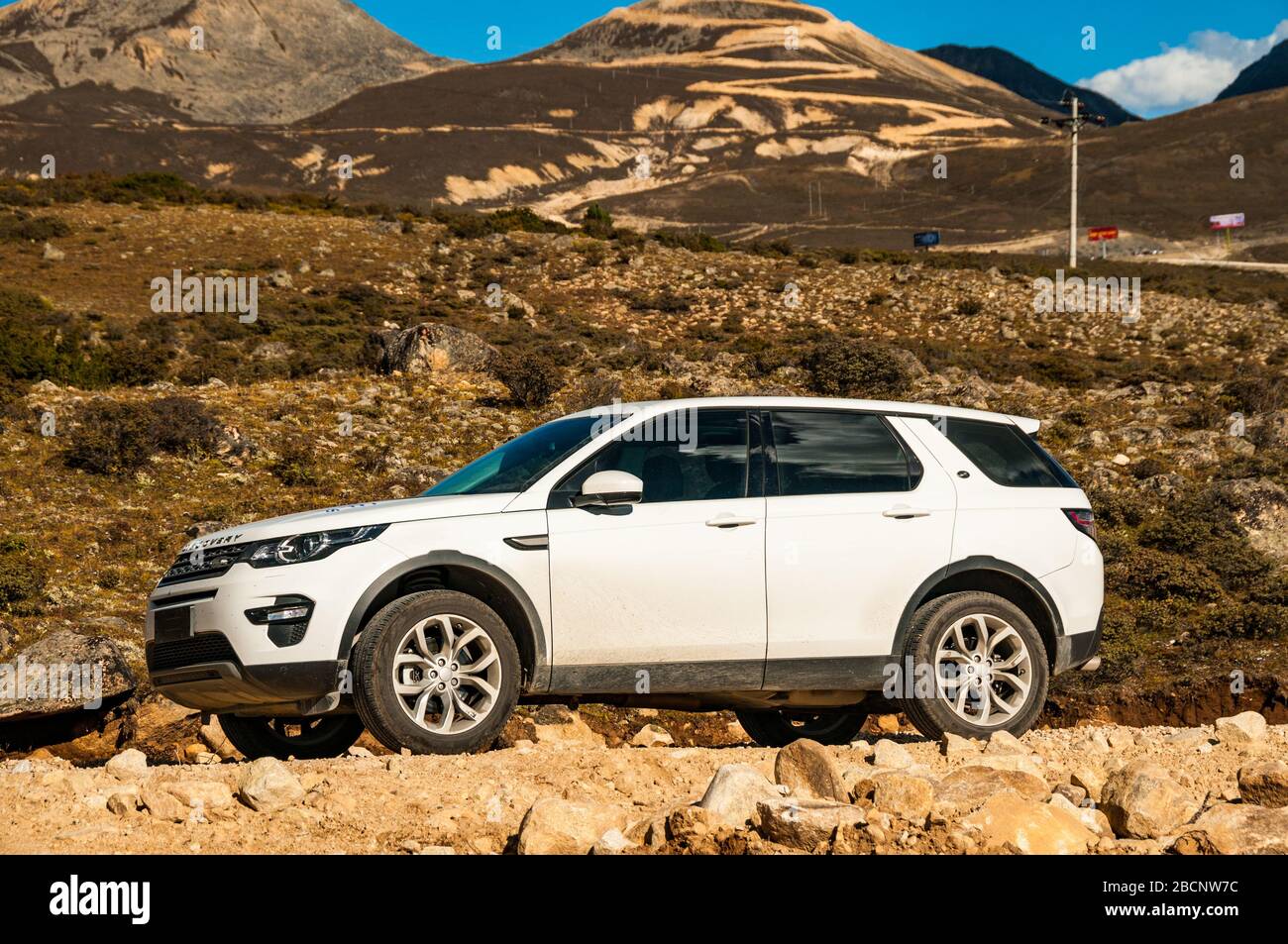 Land Rover Discovery Sport off road on a quarry track near Kangding ...