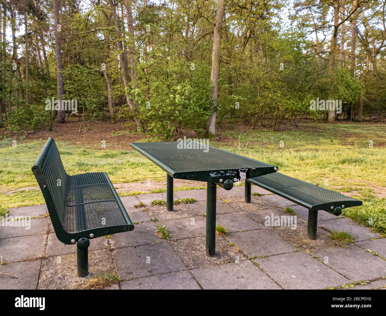 A parking lot in Europe. iron bench, table in the parking lot Stock ...