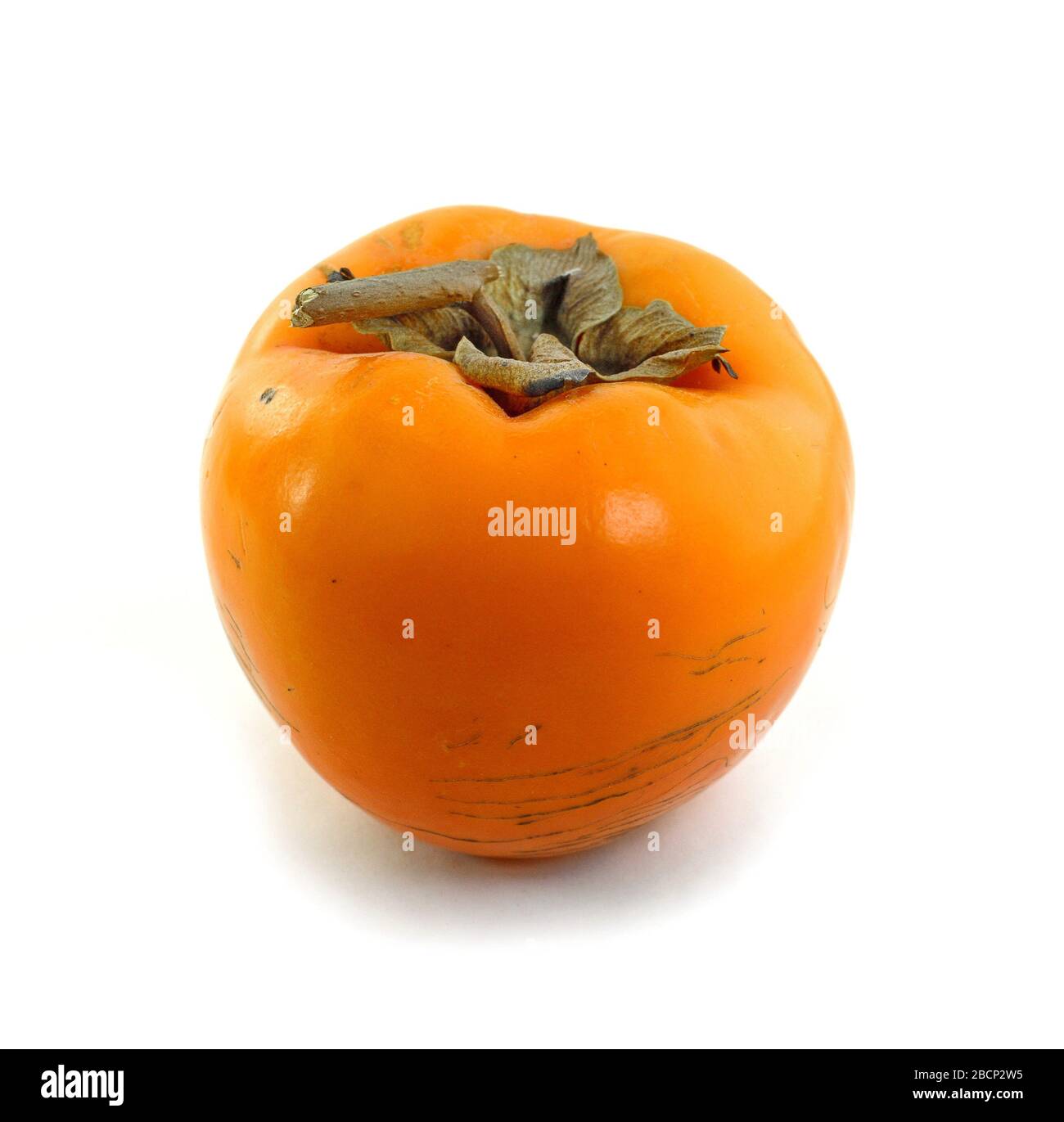 Fresh bright whole persimmon Cut Out Stock Images & Pictures - Alamy