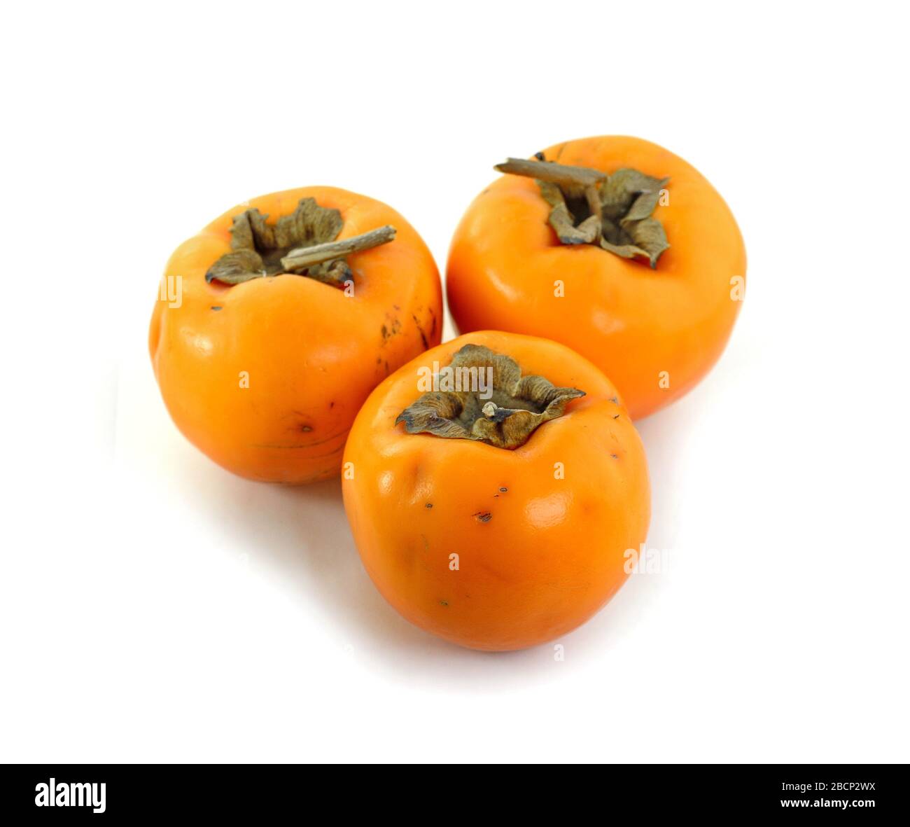 fresh ripe persimmons isolated on white background Stock Photo - Alamy