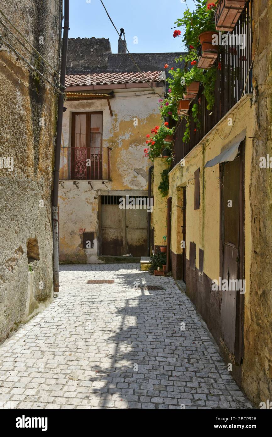 A narrow street in a small village in southern Italy Stock Photo - Alamy