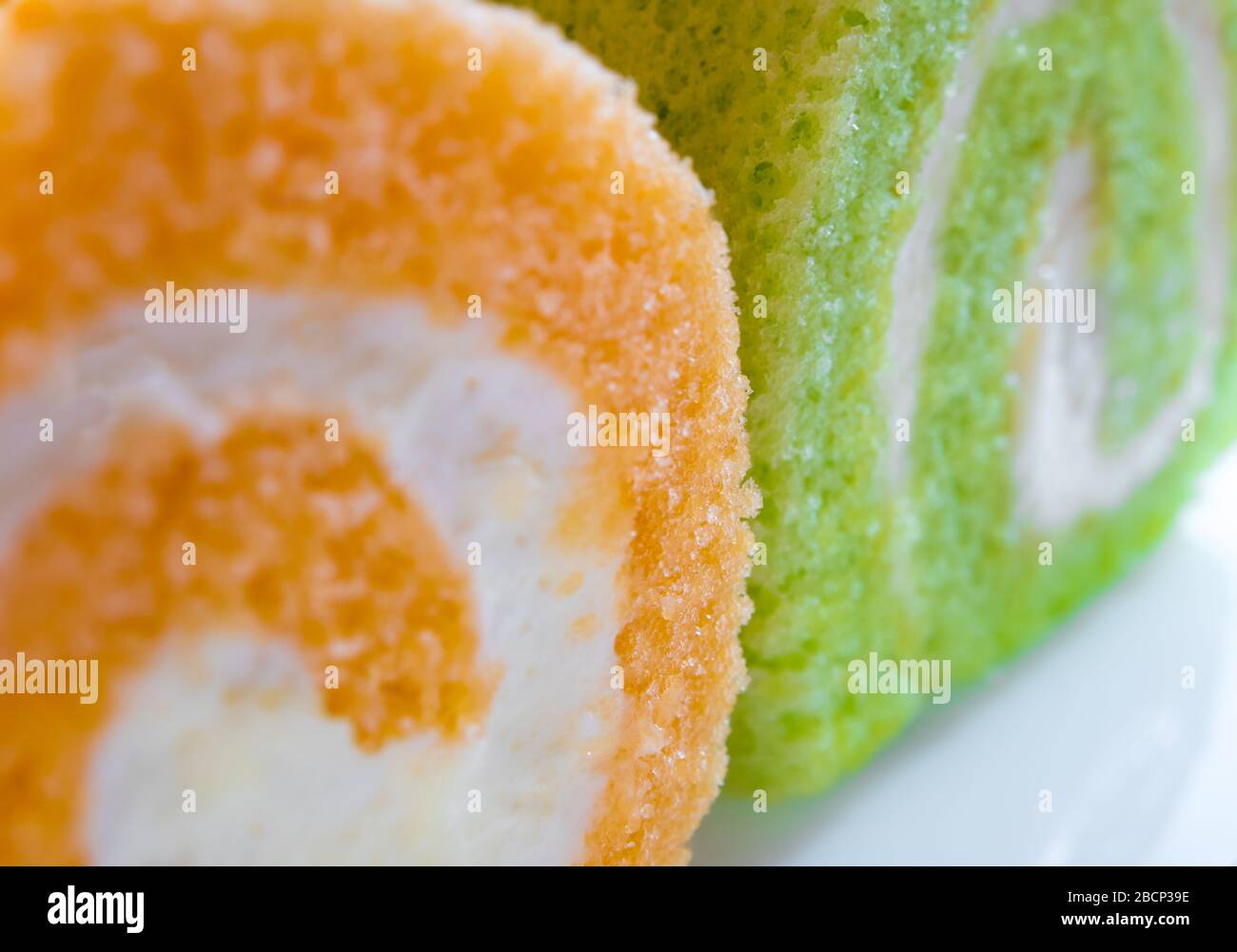 Texture detail on surface of cream and orange flavor roll cake Stock ...