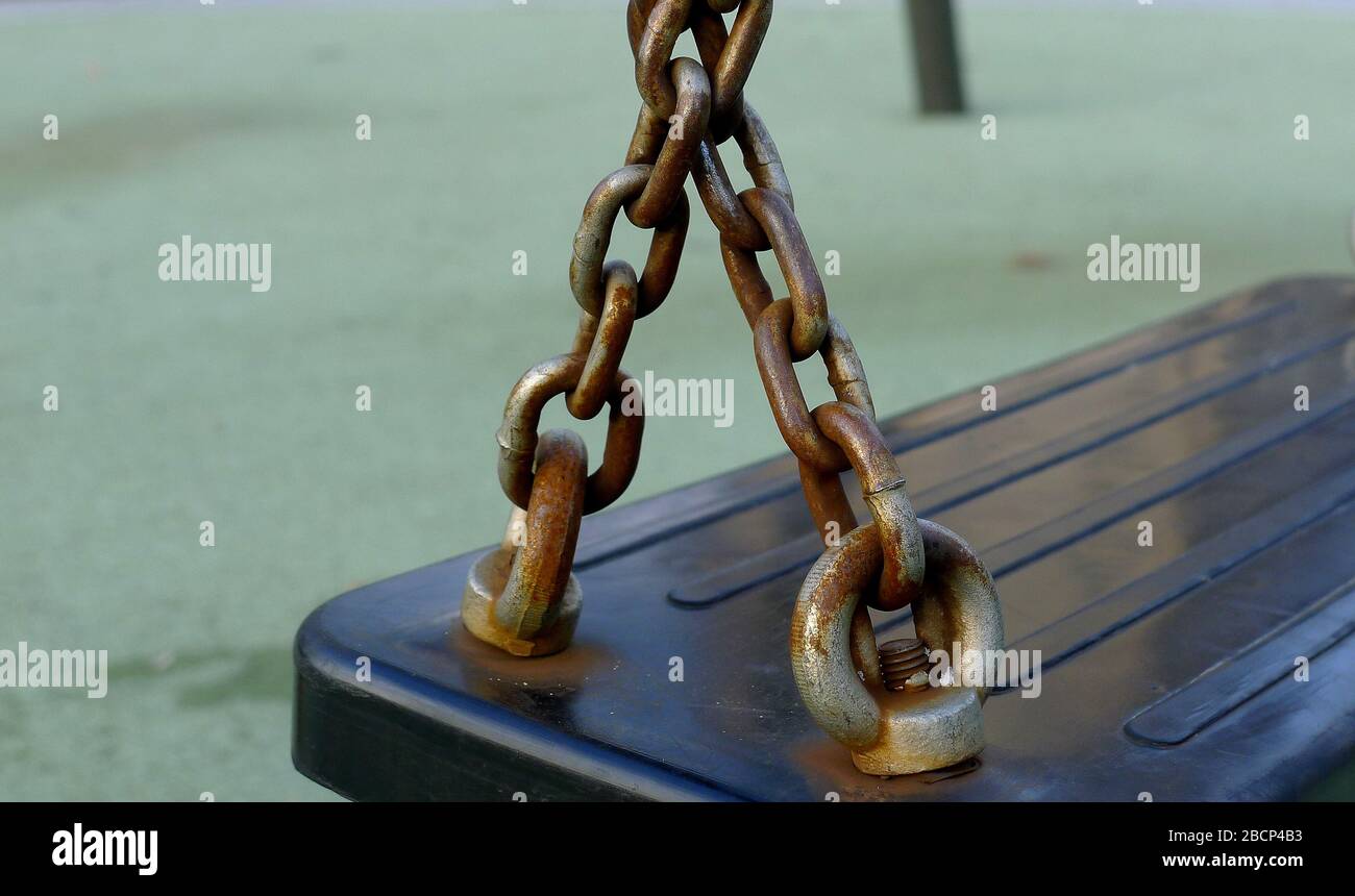 Outdoor swing, chains holding the seat. Children's playground in Swing ...
