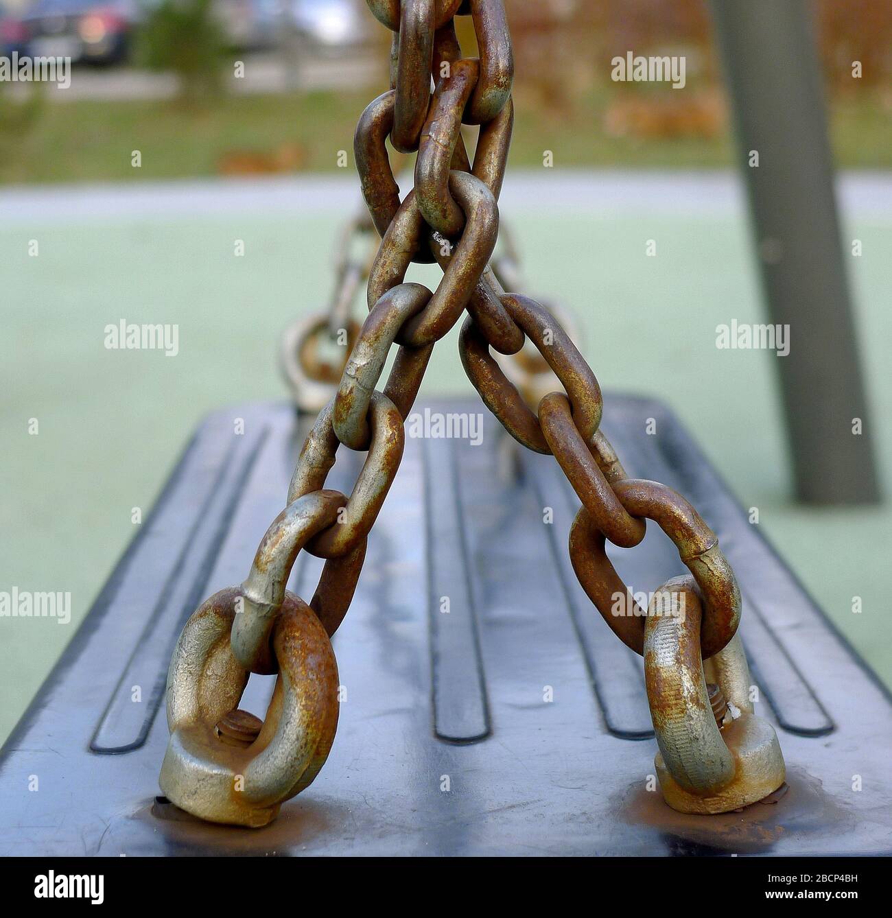 Outdoor swing, chains holding the seat. Children's playground in Swing ...