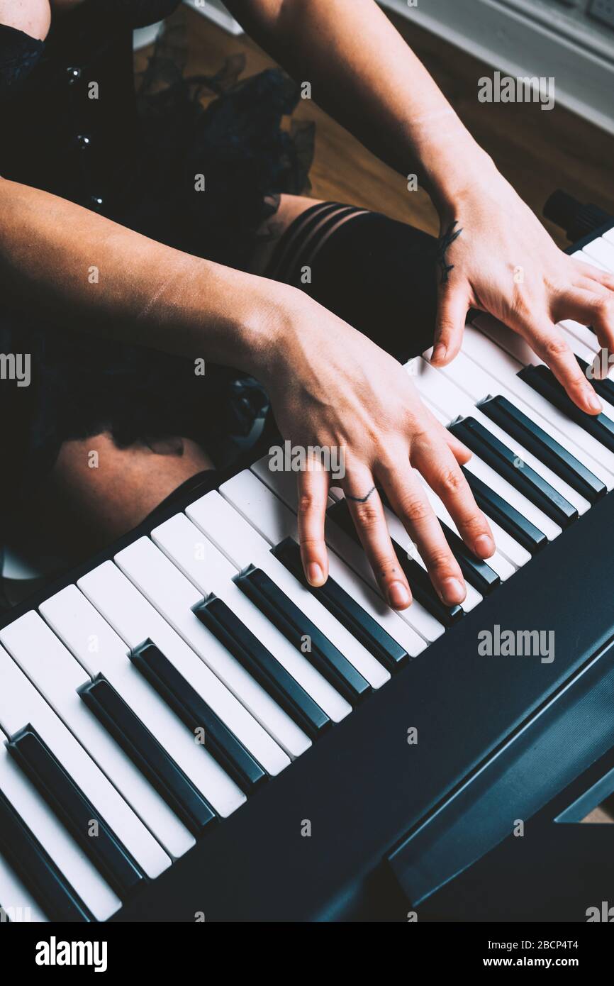 Music keyboard woman hi-res stock photography and images - Alamy