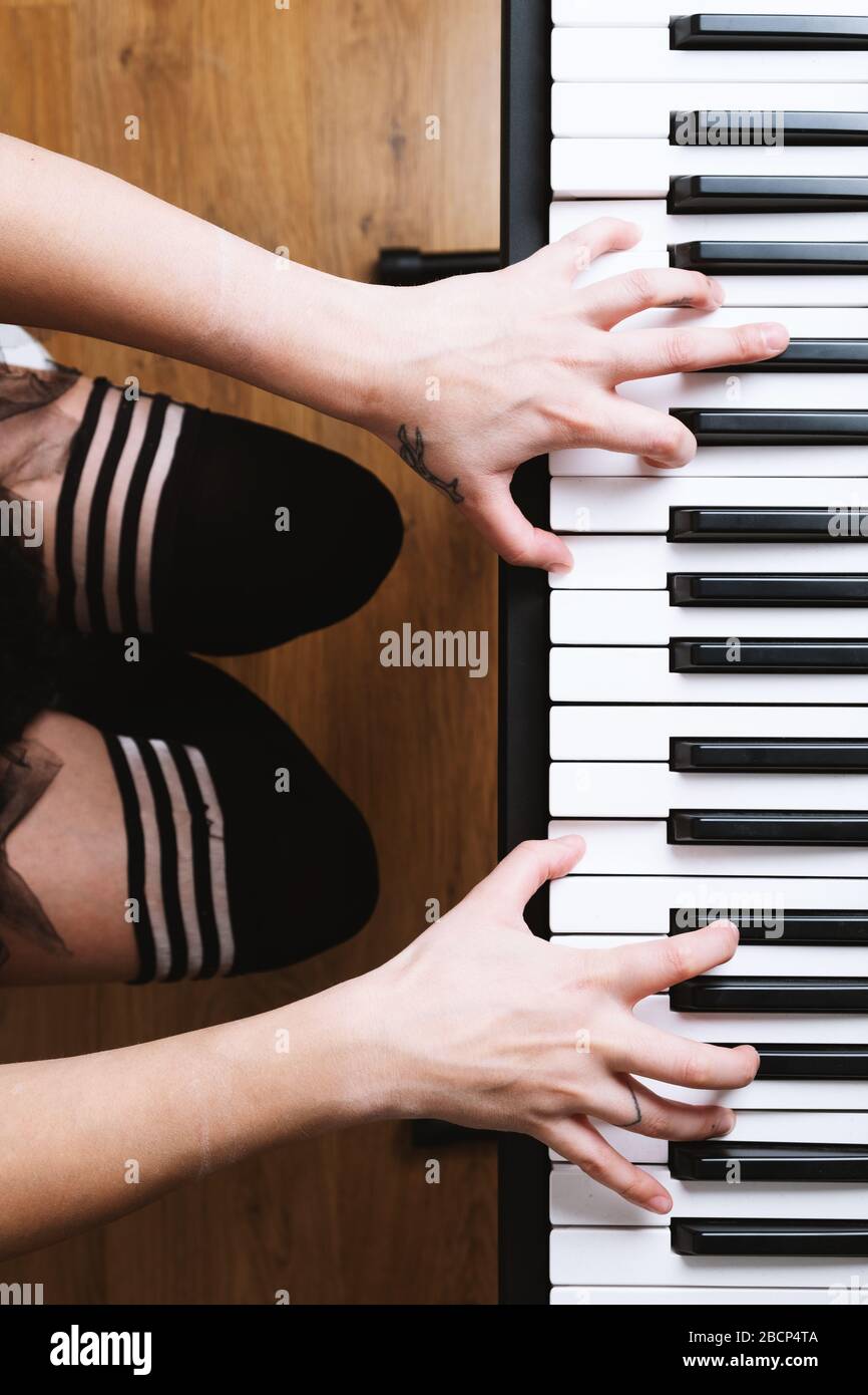 Close-up of a woman's hands playing the keyboard Stock Photo - Alamy