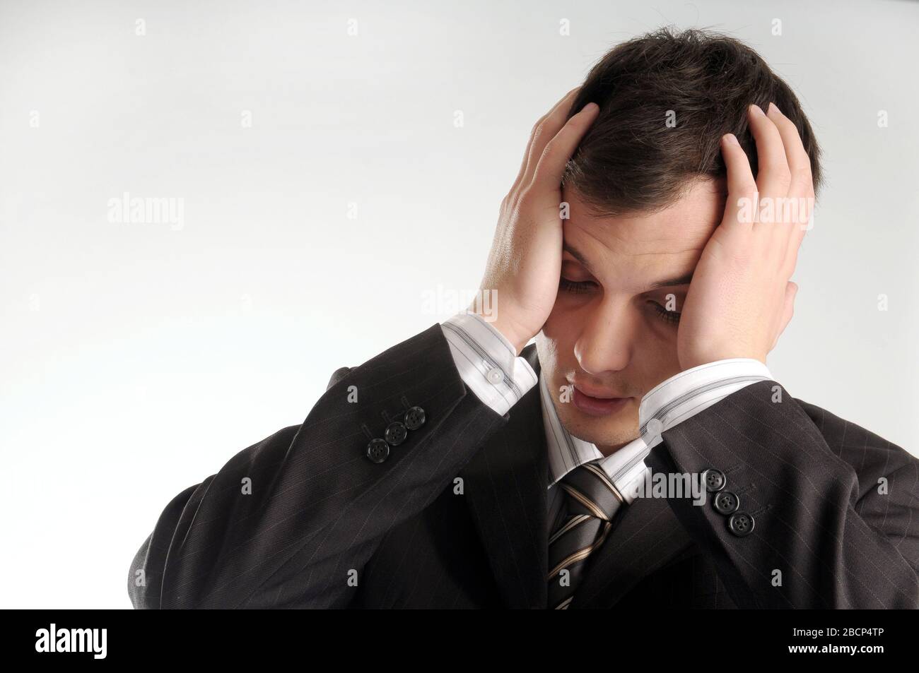 Young worried manager in black suit Stock Photo - Alamy