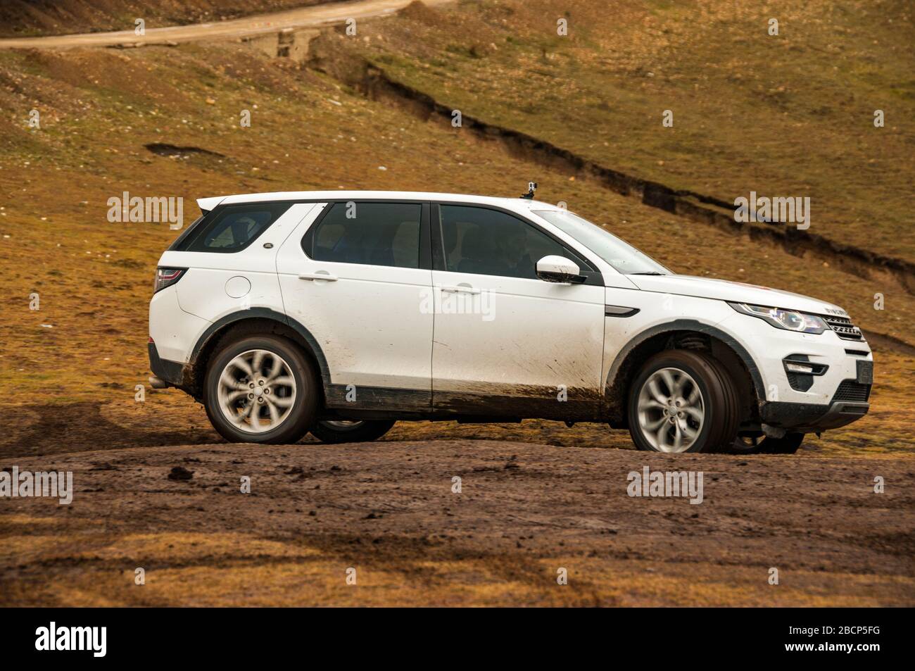 Land Rover Discovery Sport being driven off road on a mountain in ...
